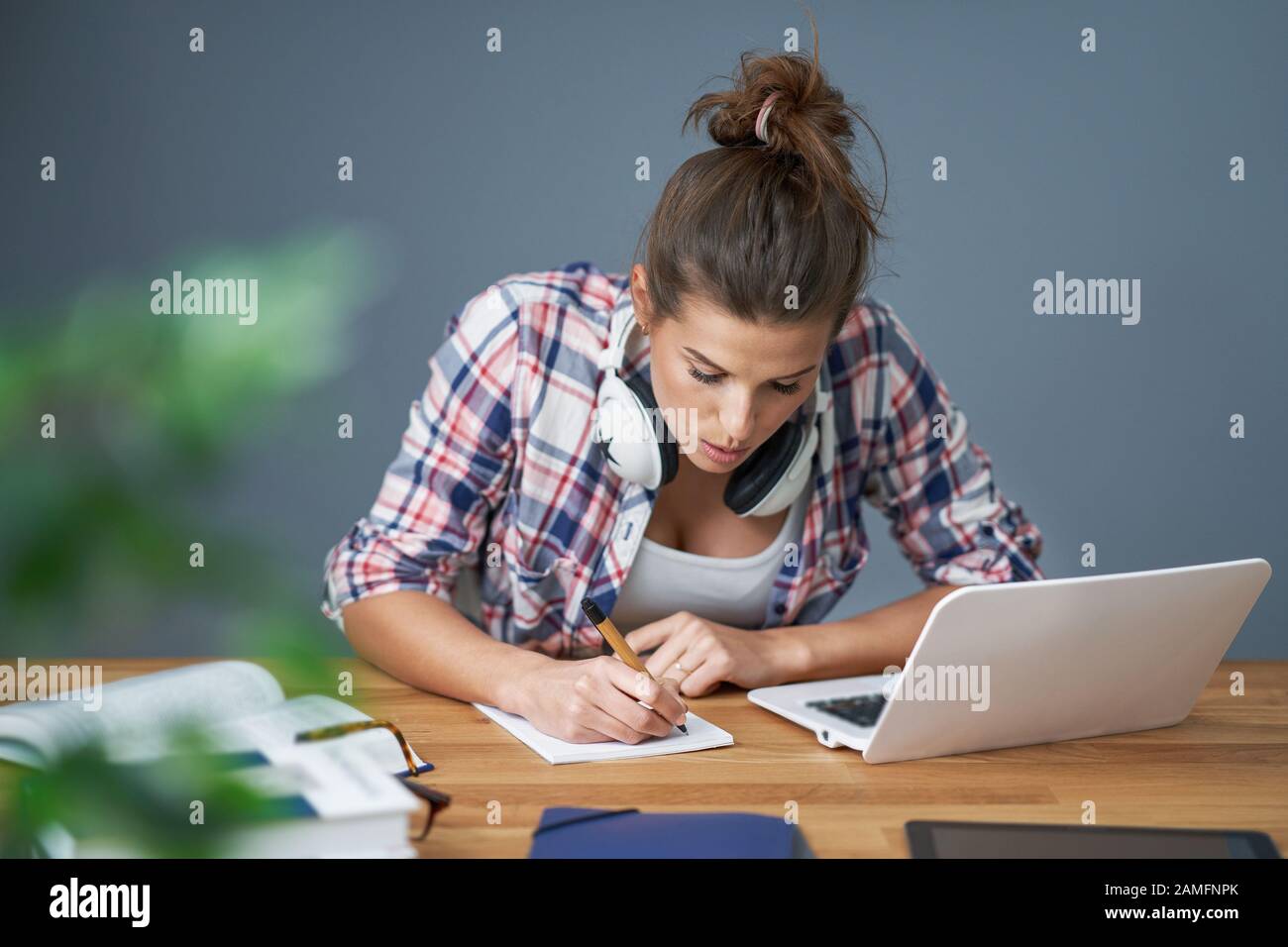 Tired female student learning till late at home Stock Photo - Alamy