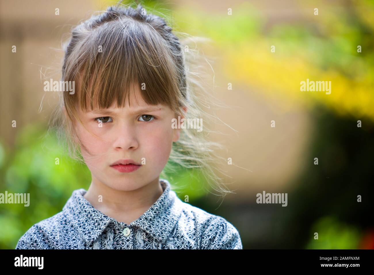 Pretty funny moody young child girl outdoor feeling angry and ...