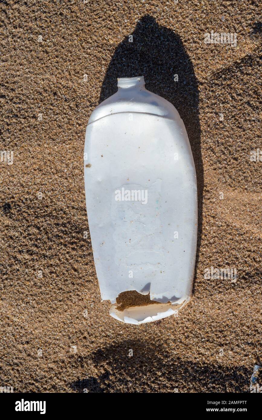 Plastic trashes on the beautiful sandy beach Stock Photo - Alamy