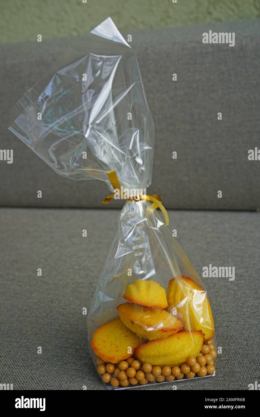 A cellophane bag filled with French madeleine cakes Stock Photo - Alamy