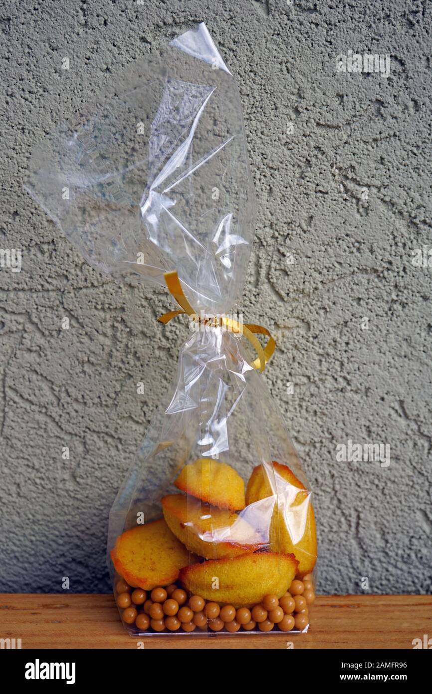 A cellophane bag filled with French madeleine cakes Stock Photo - Alamy