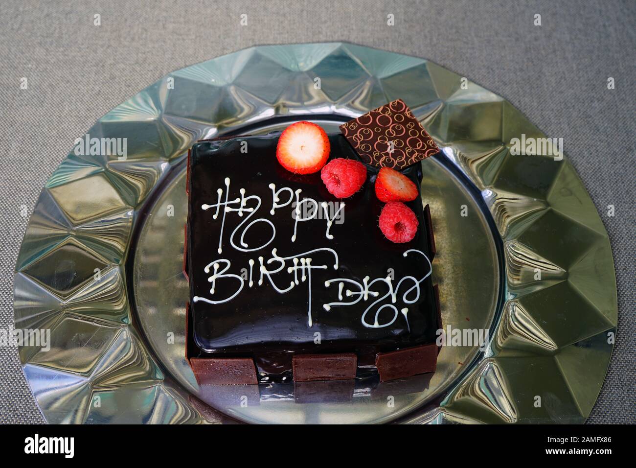 Happy birthday on a chocolate cake Stock Photo - Alamy