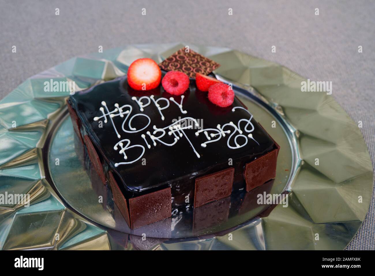 Happy birthday on a chocolate cake Stock Photo - Alamy
