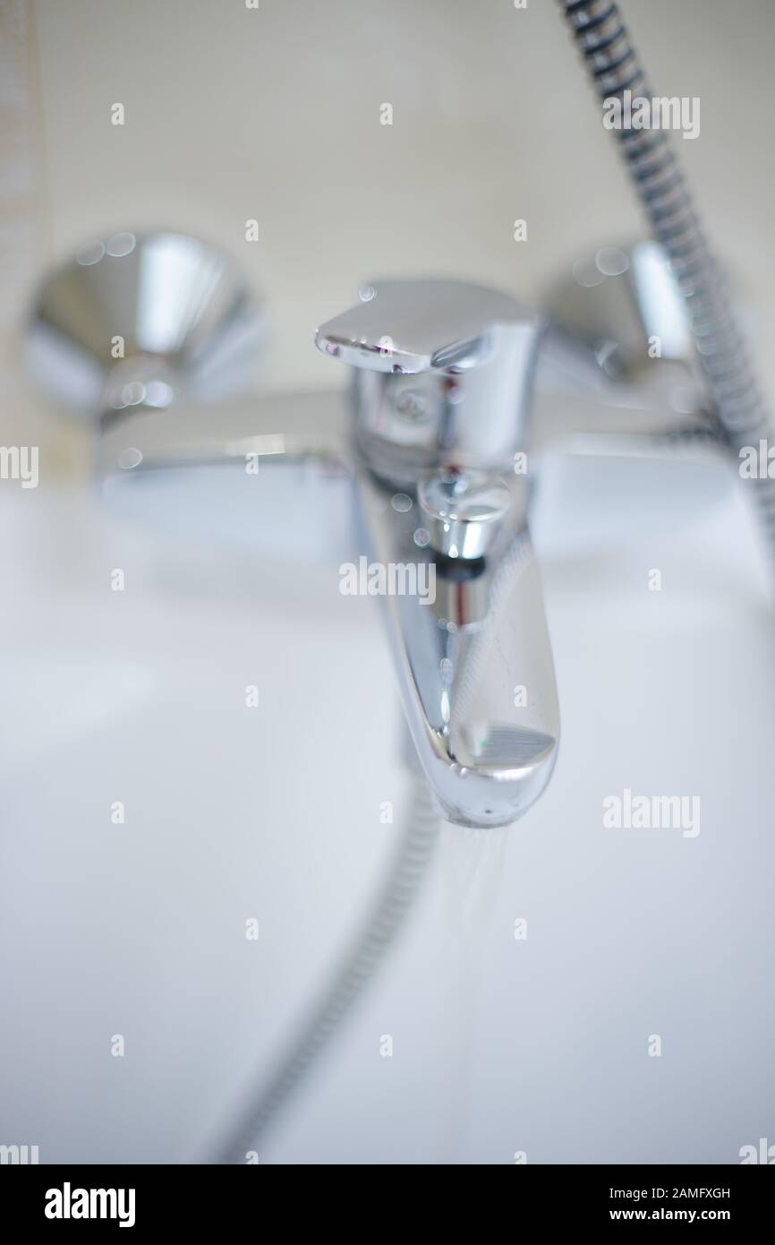 Chrome water tap. Shiny faucet closeup Stock Photo - Alamy