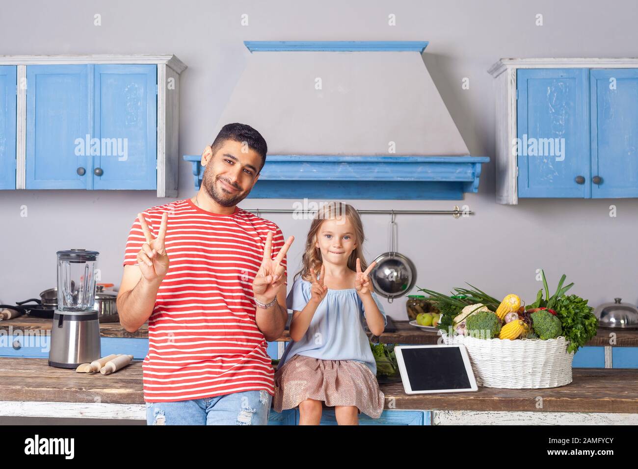 Happy indian family in kitchen hi-res stock photography and images - Alamy