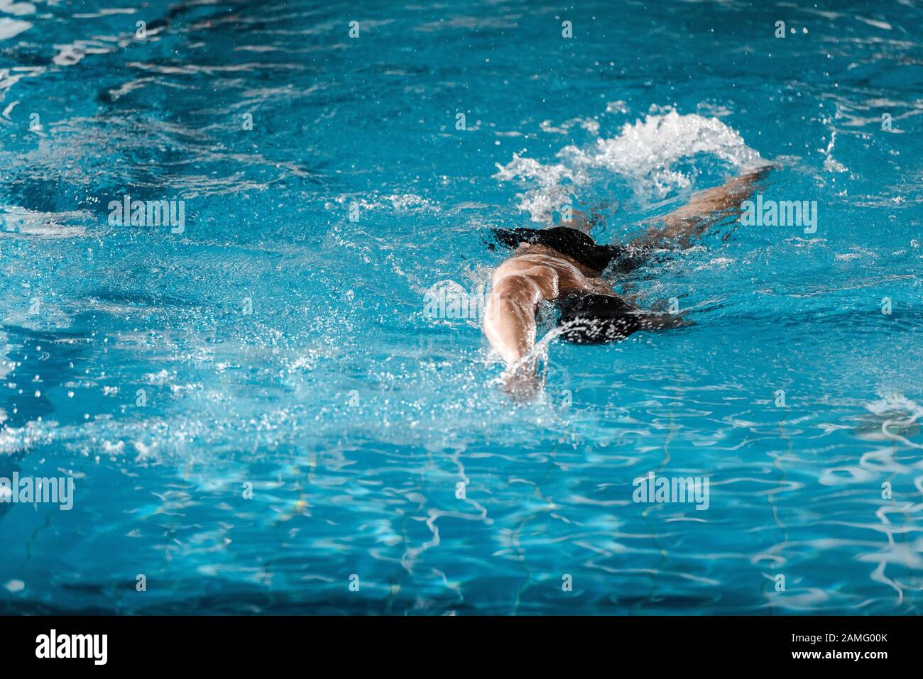 athletic man diving in swimming pool with blue water Stock Photo - Alamy
