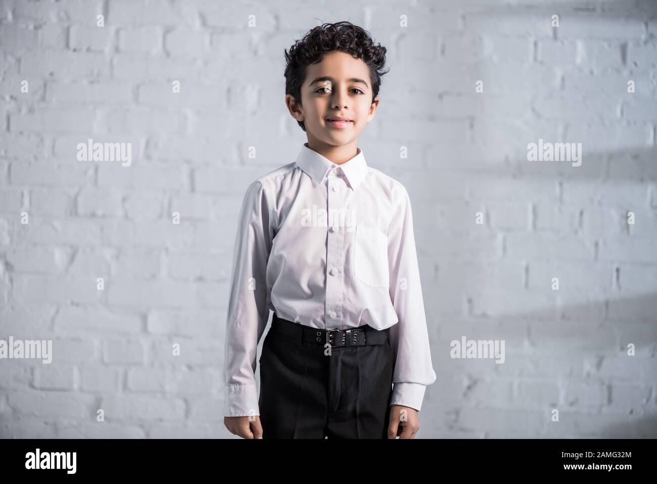 cute and smiling jewish boy in shirt looking at camera Stock Photo - Alamy