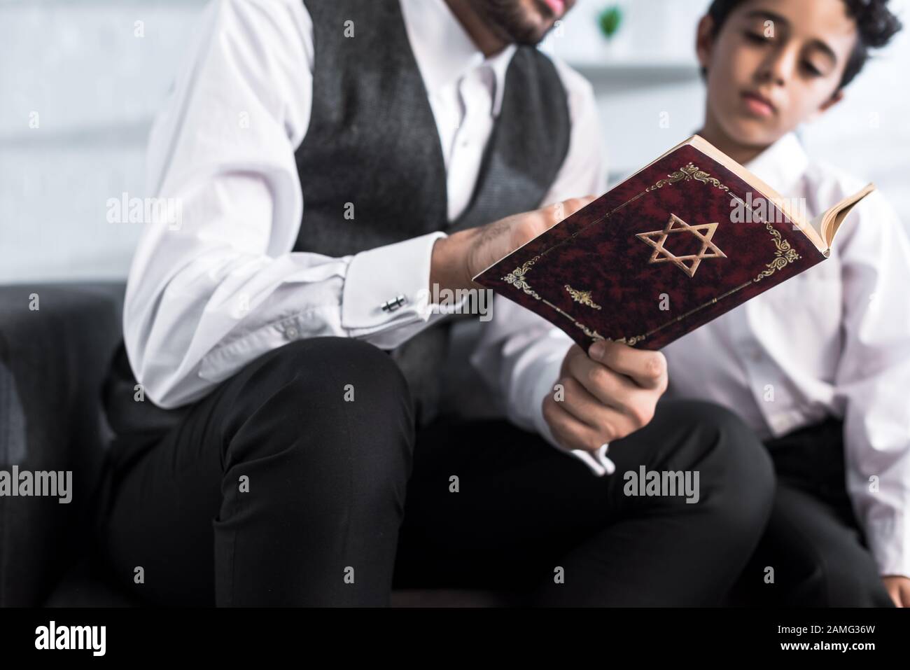 Father and son reading bible hi-res stock photography and images - Alamy