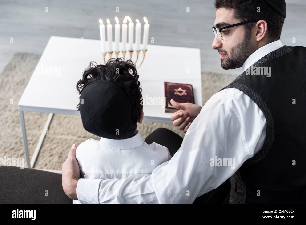 overhead view of jewish father hugging son in apartment Stock Photo - Alamy
