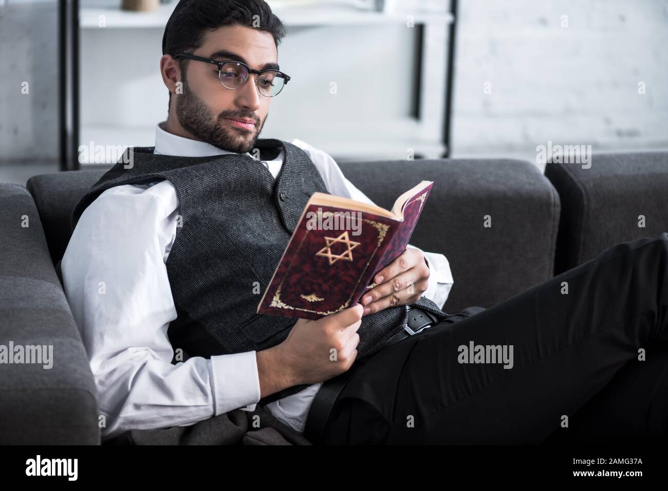 handsome and young jewish man in glasses reading tanakh Stock Photo - Alamy