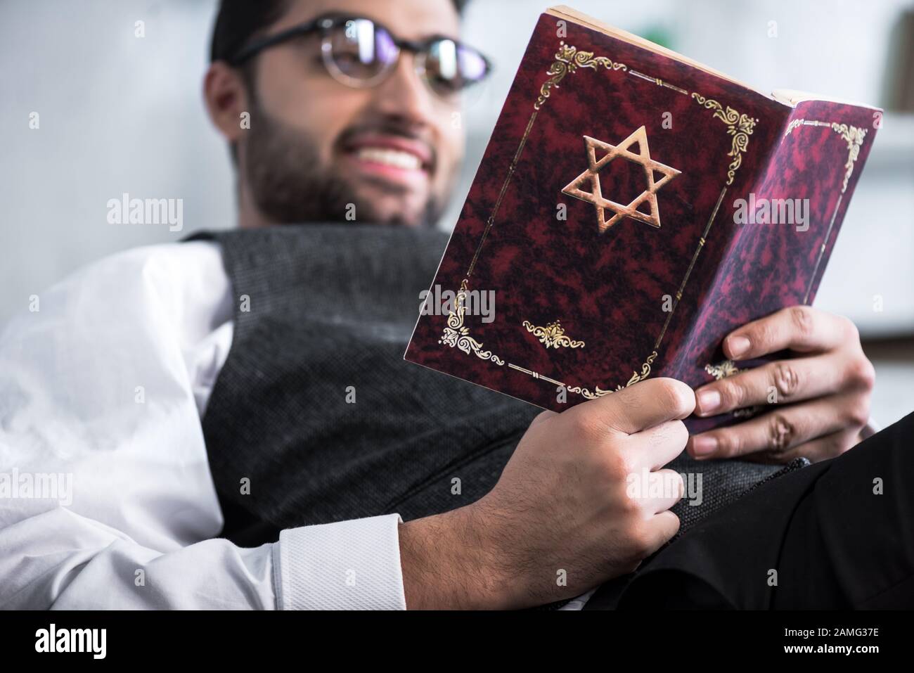 selective focus of smiling jewish man in glasses reading tanakh Stock ...