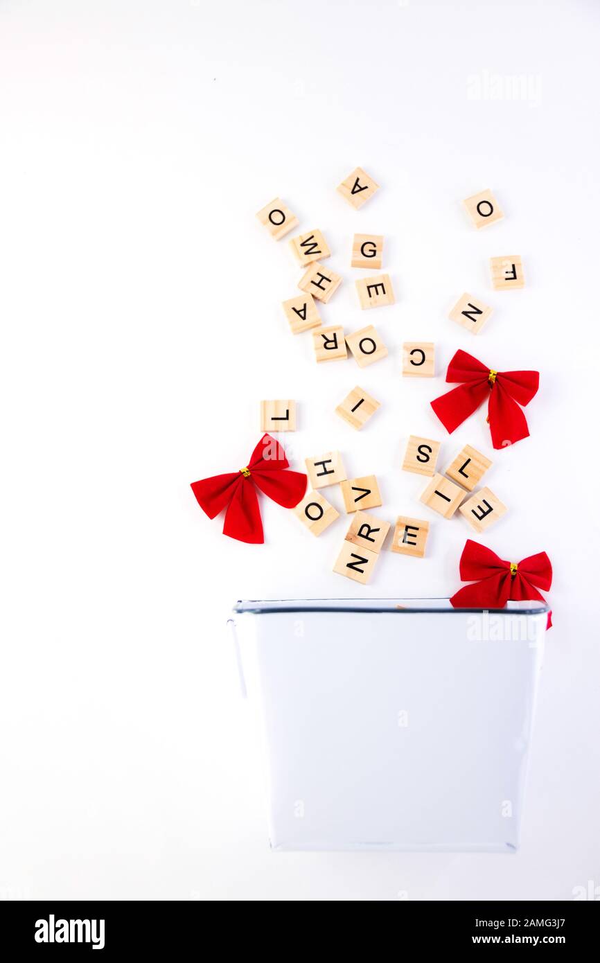 Text, message, letter scattered in white rectangular bucket with red ...