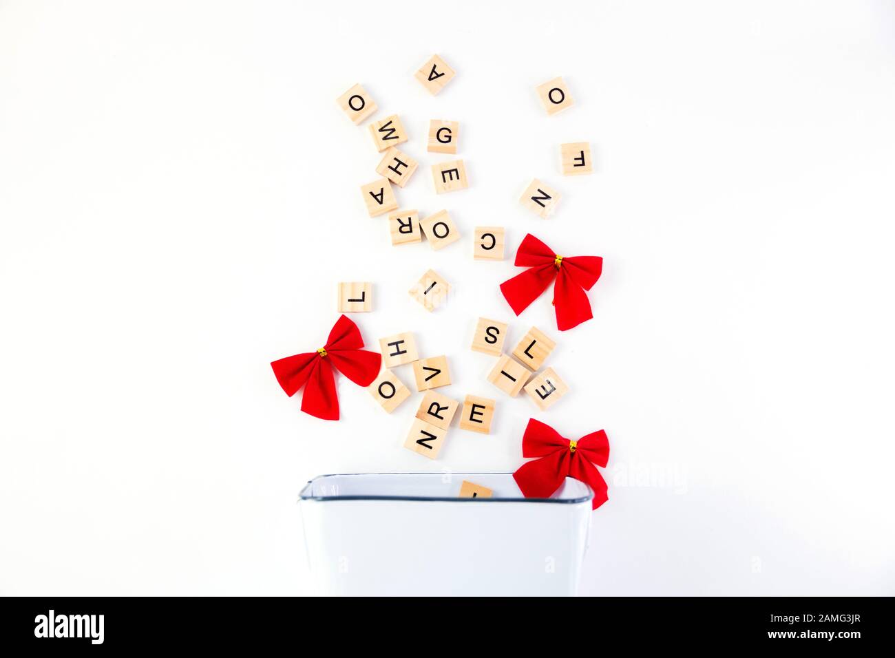 Text, message, letter scattered in white rectangular bucket with red ...