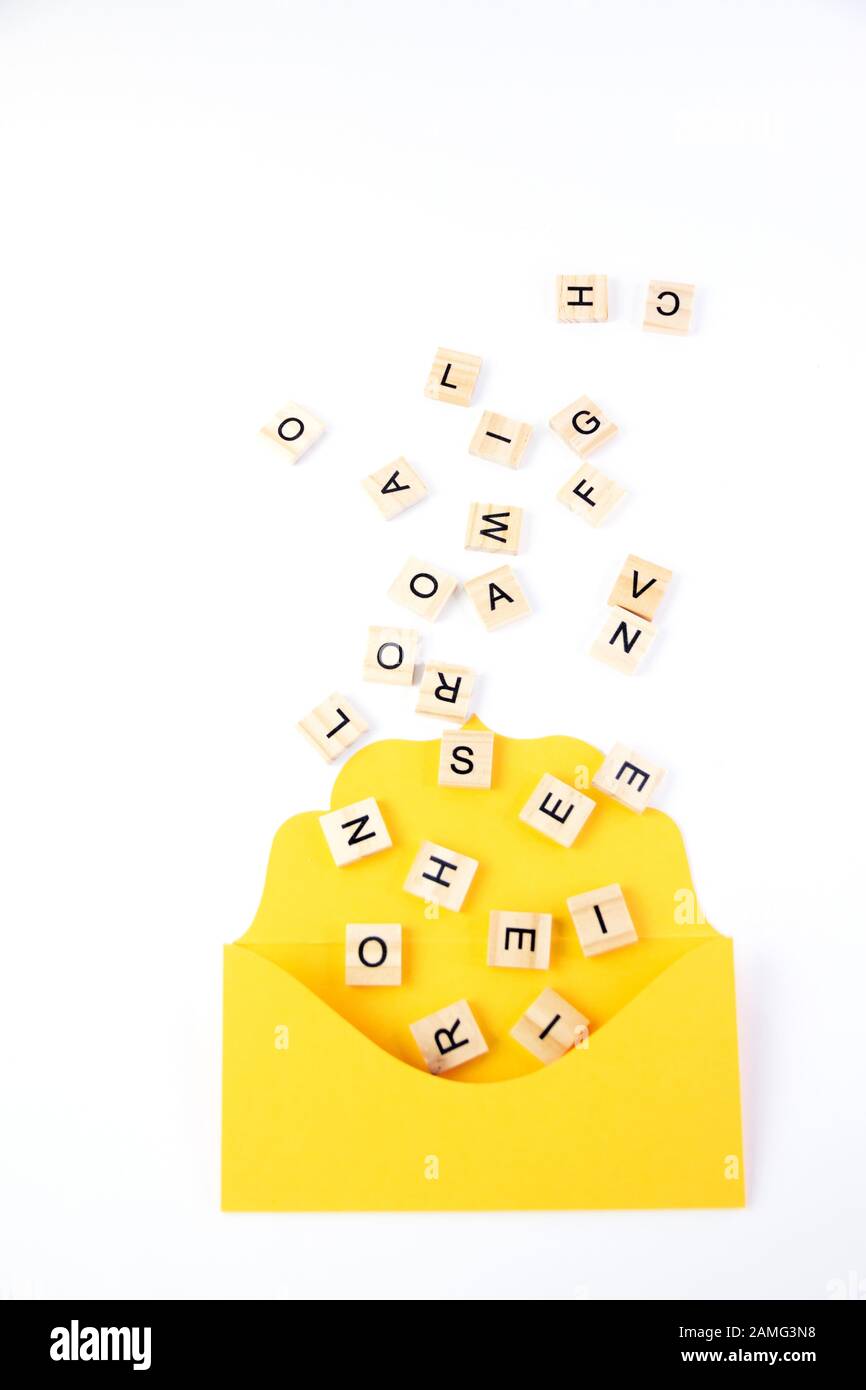 Text, message, letters scattered in yellow envelope isolated on white ...