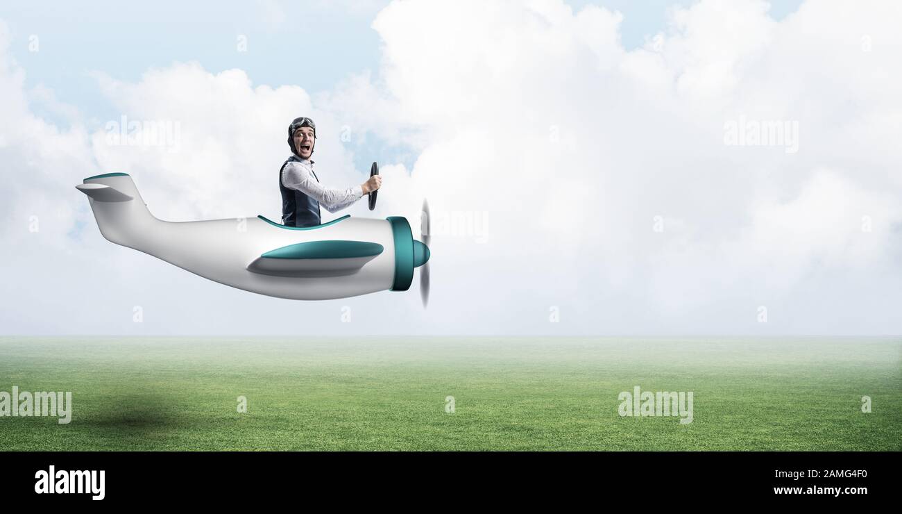Happy aviator driving small propeller plane Stock Photo - Alamy