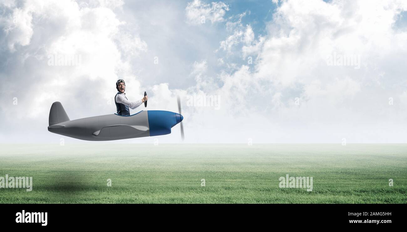 Happy aviator driving small propeller plane Stock Photo - Alamy