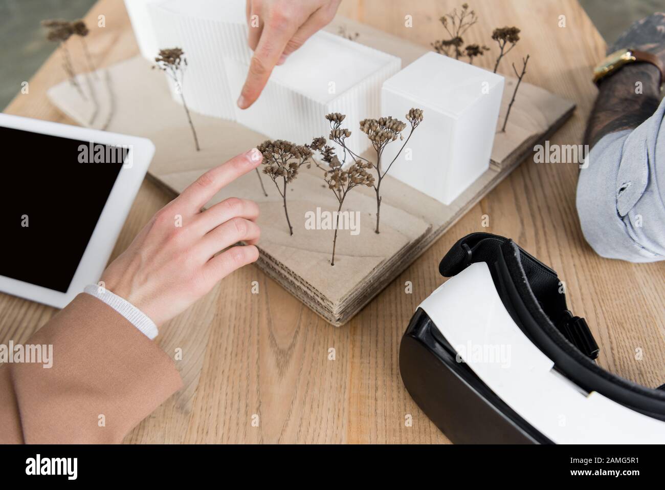 cropped view of virtual reality architects pointing with fingers at ... cropped view of virtual reality architects pointing with fingers at ...