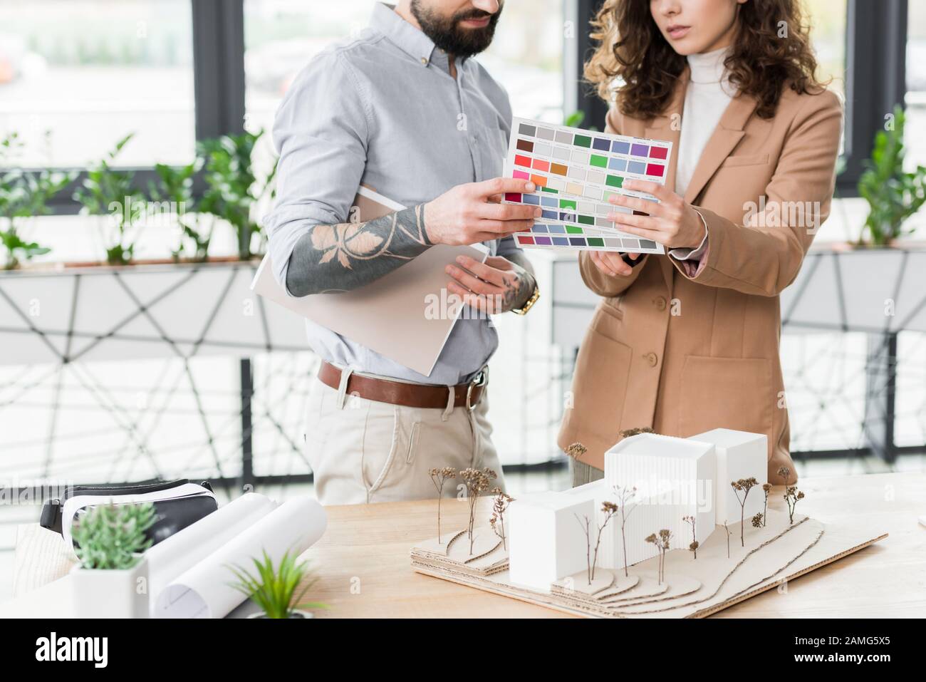 cropped view of virtual reality architects looking at layout of colors ... cropped view of virtual reality architects looking at layout of colors ...