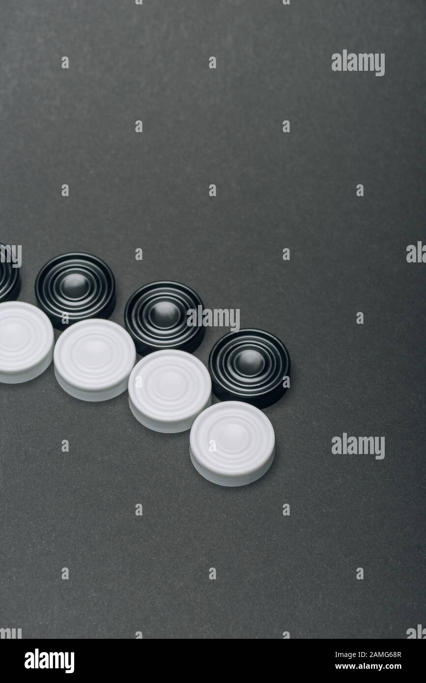 Rows of black and white checkers isolated on grey Stock Photo - Alamy