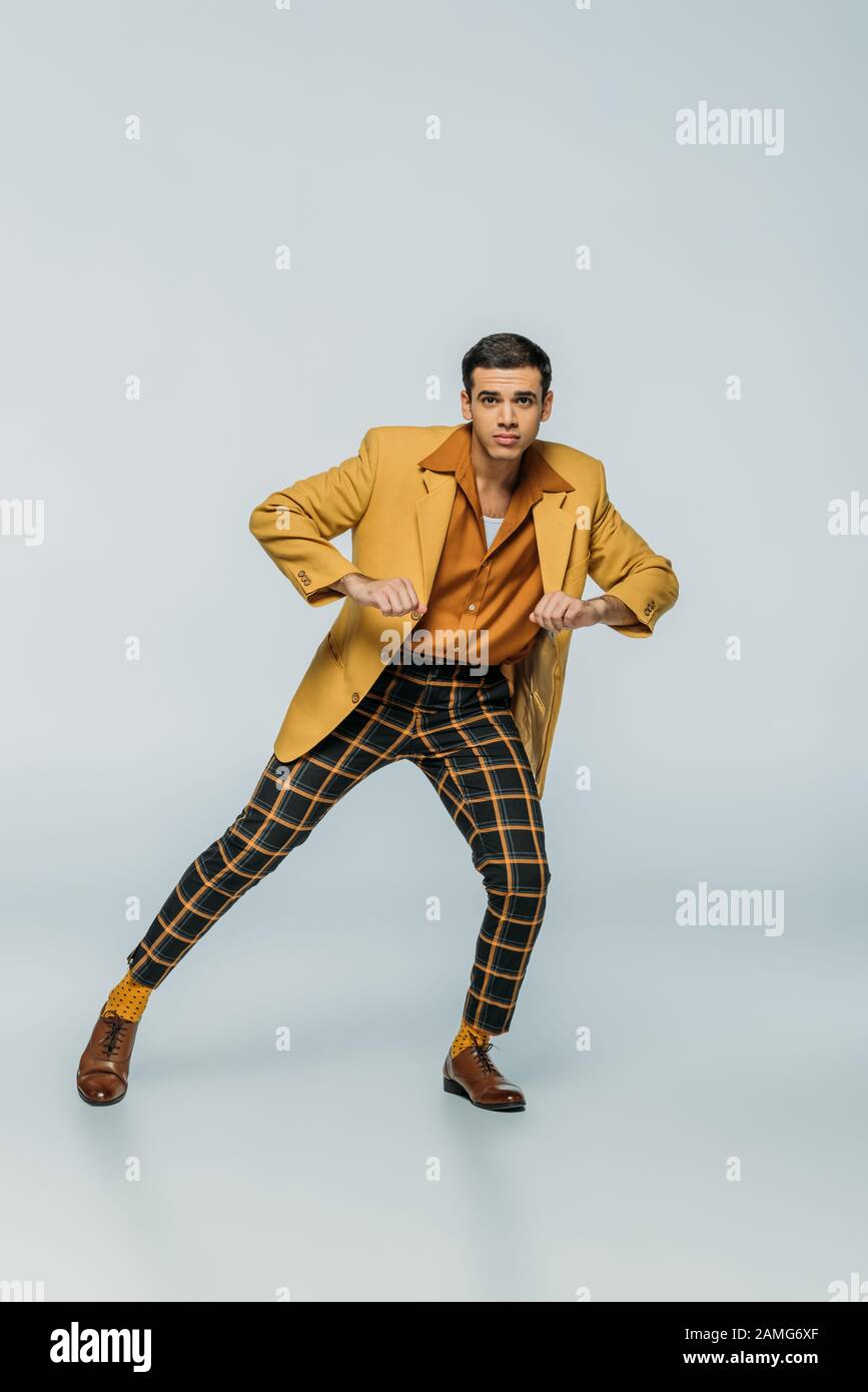 good-looking, elegant dancer looking at camera while dancing boogie ...