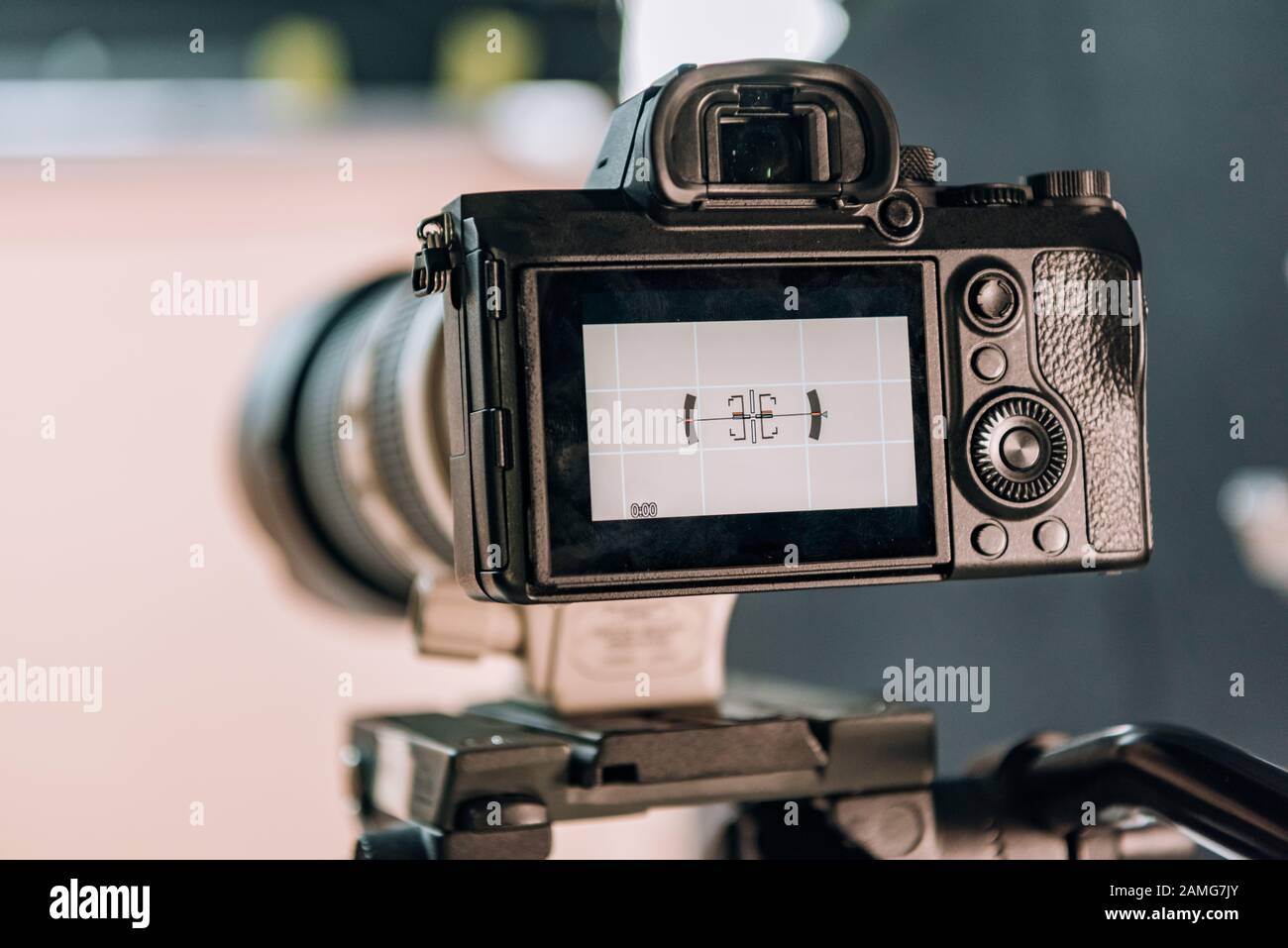 Selective focus of electronic level on camera display in photo studio ...