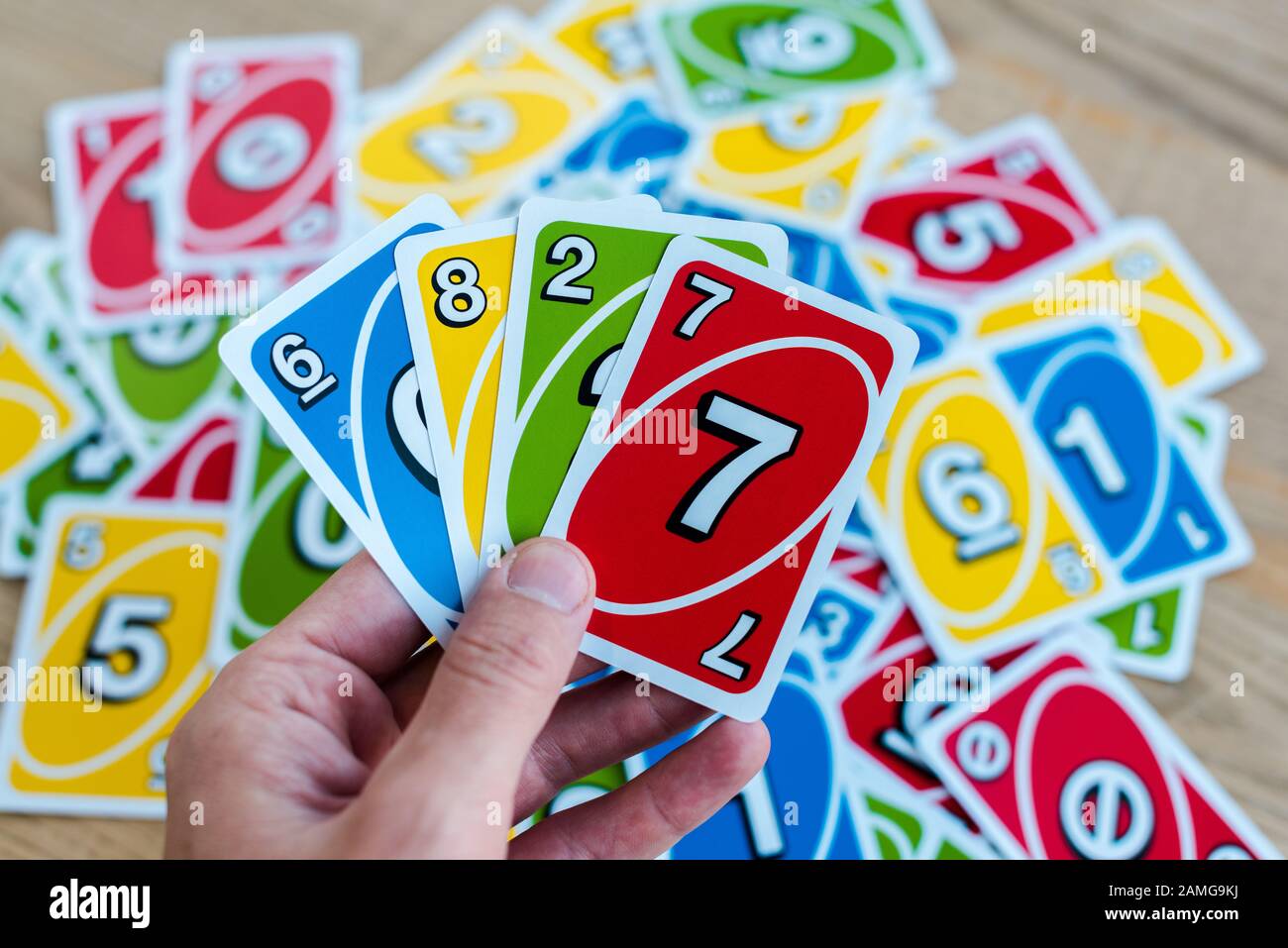 KYIV, UKRAINE - NOVEMBER 22, 2019: cropped view of man holding colorful ...