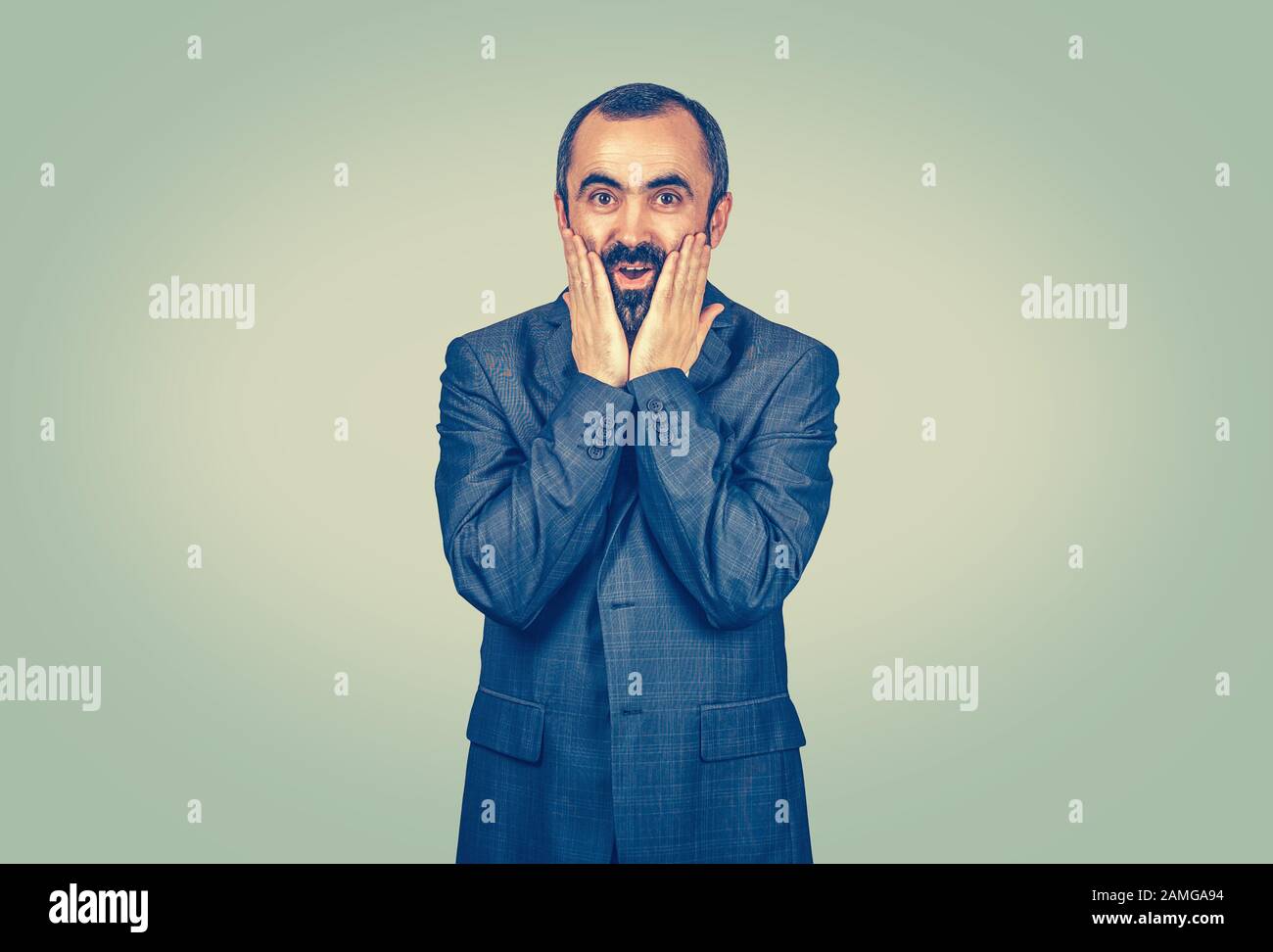 Happy adult handsome man looking shocked surprised in disbelief hands ...
