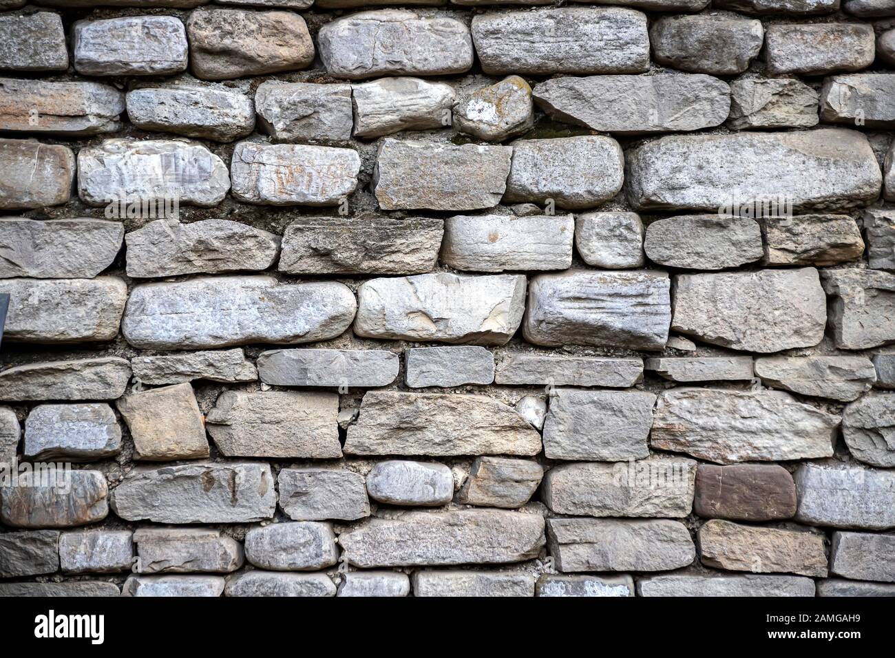 Abstract masonry wall surface of gray textured stones close up Stock ...