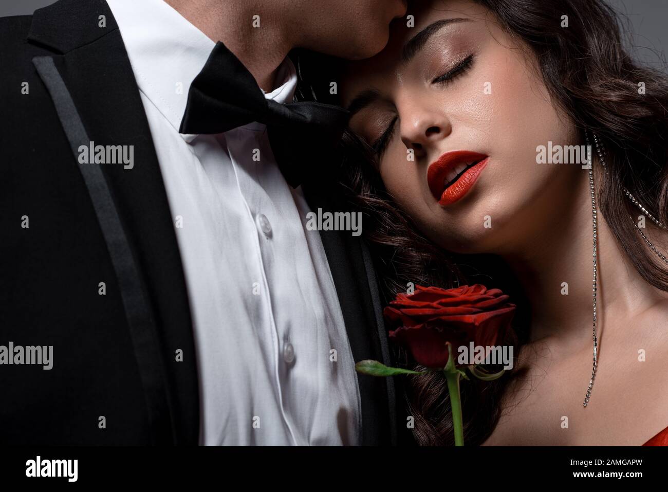 beautiful Romantic couple hugging and holding red rose flower Stock ...