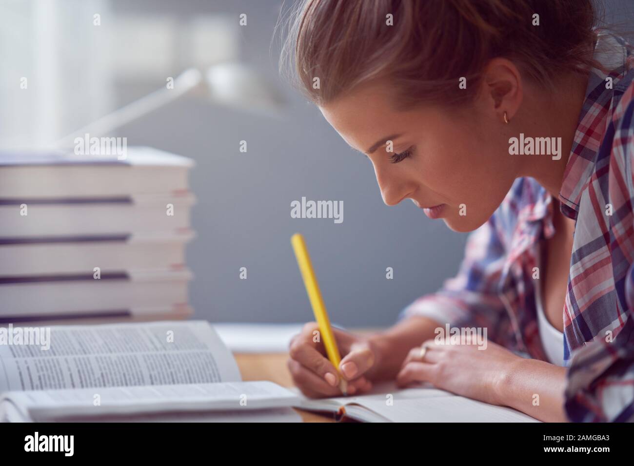 Female student learning at home Stock Photo - Alamy