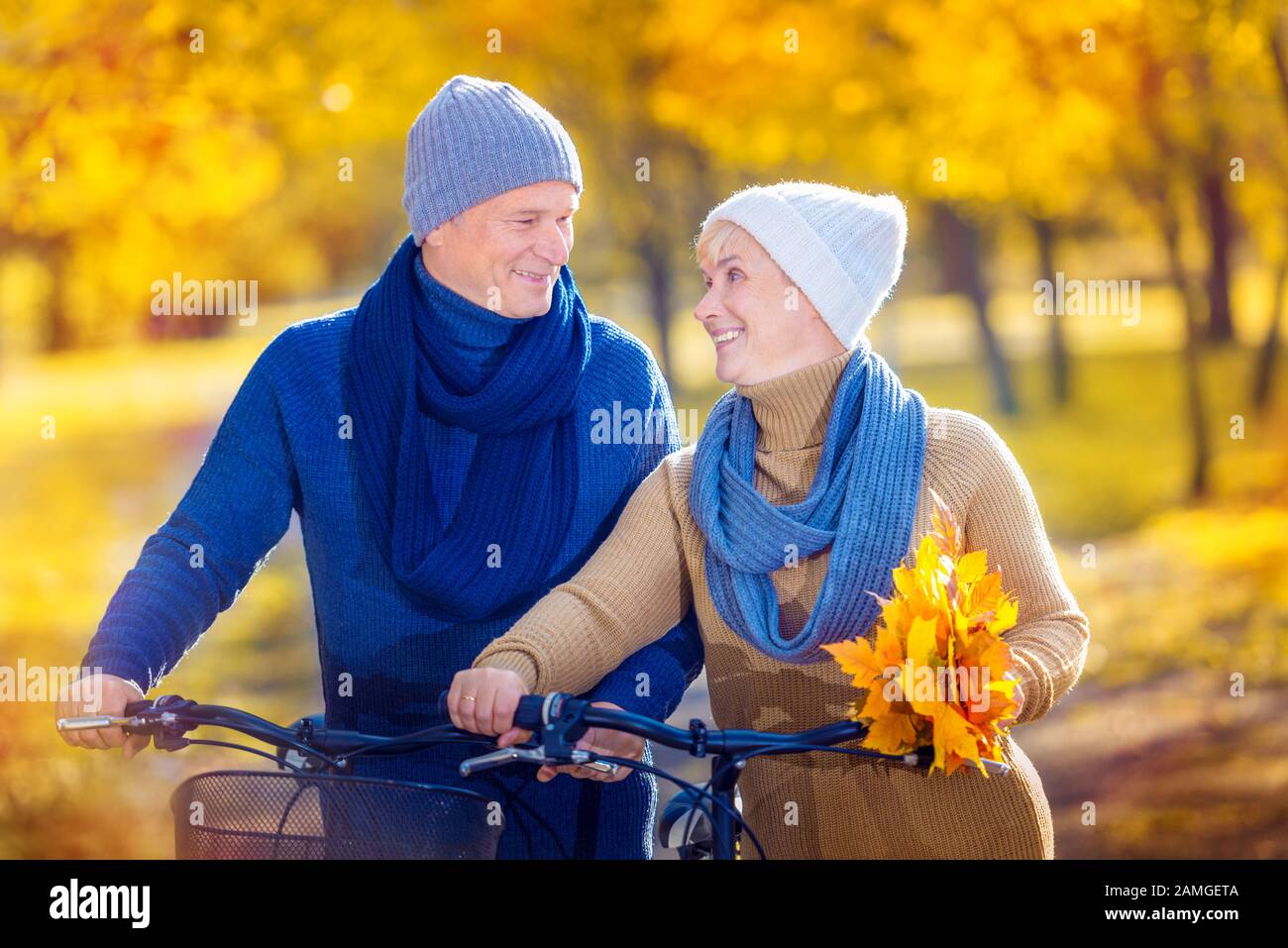 senior couple relaxing outdoors in autumn park Stock Photo - Alamy