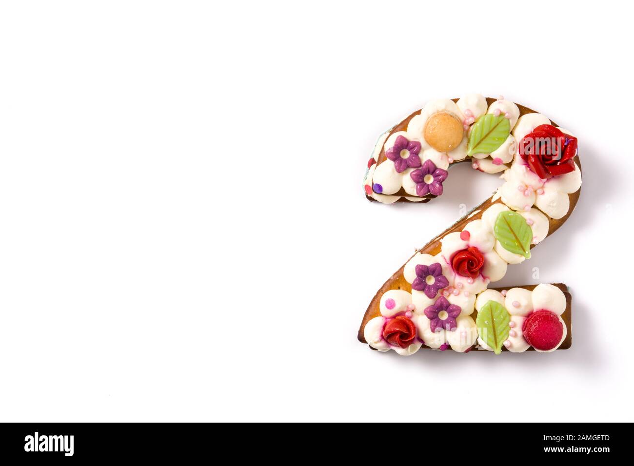 Number two cake decorated with flowers and macarons isolated on white ...