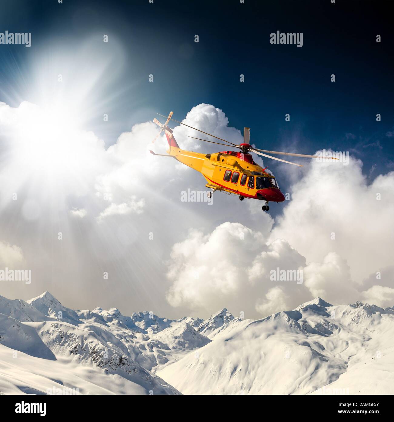 helicopter rescue flight on the snow covered alps Stock Photo - Alamy