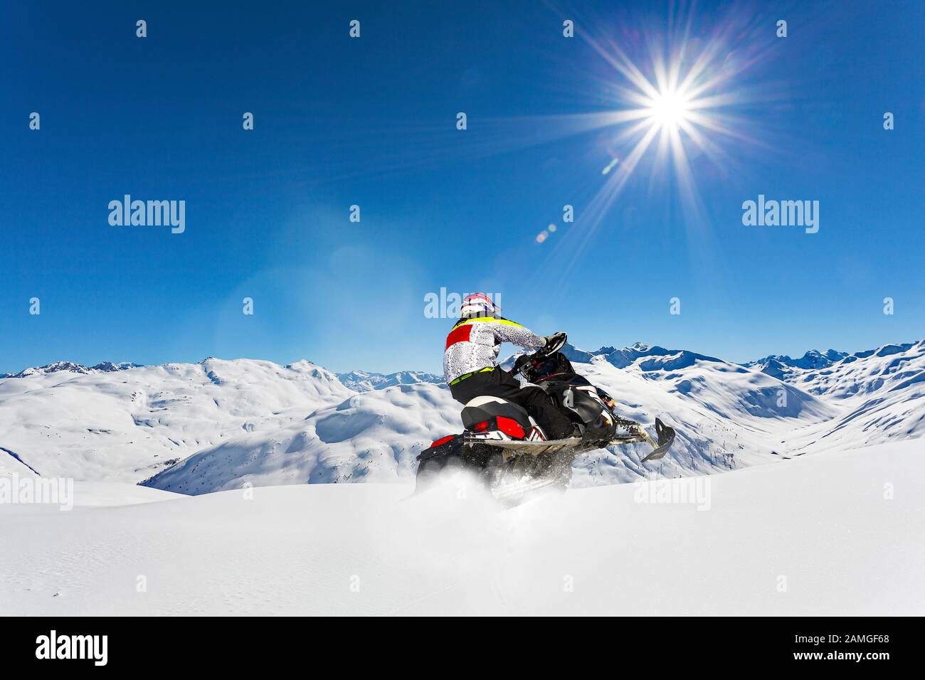 snowmobile excursion in a snowy Alpine valley Stock Photo - Alamy