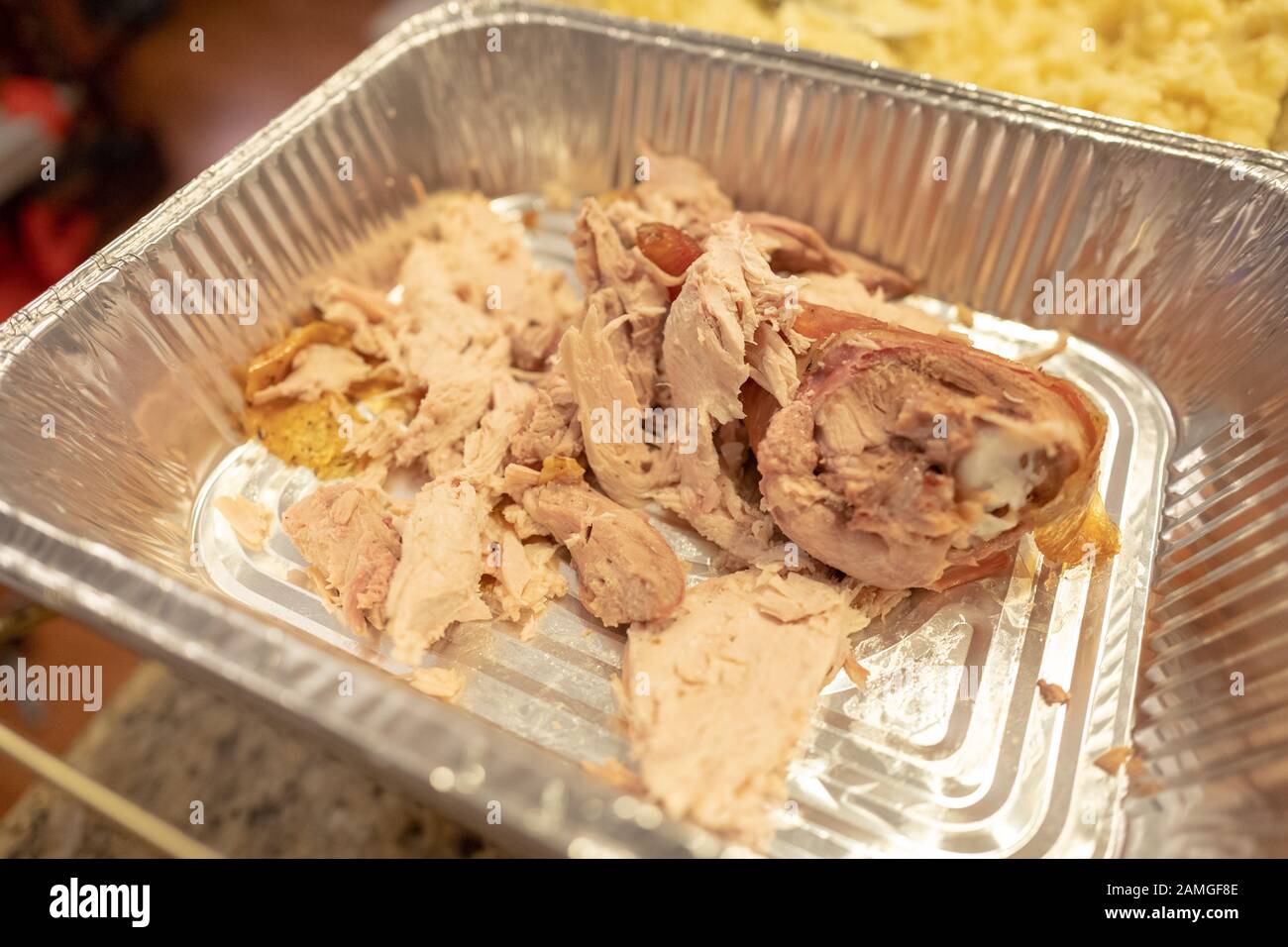 Sliced turkey in steam tray during the preparation of a traditional ...