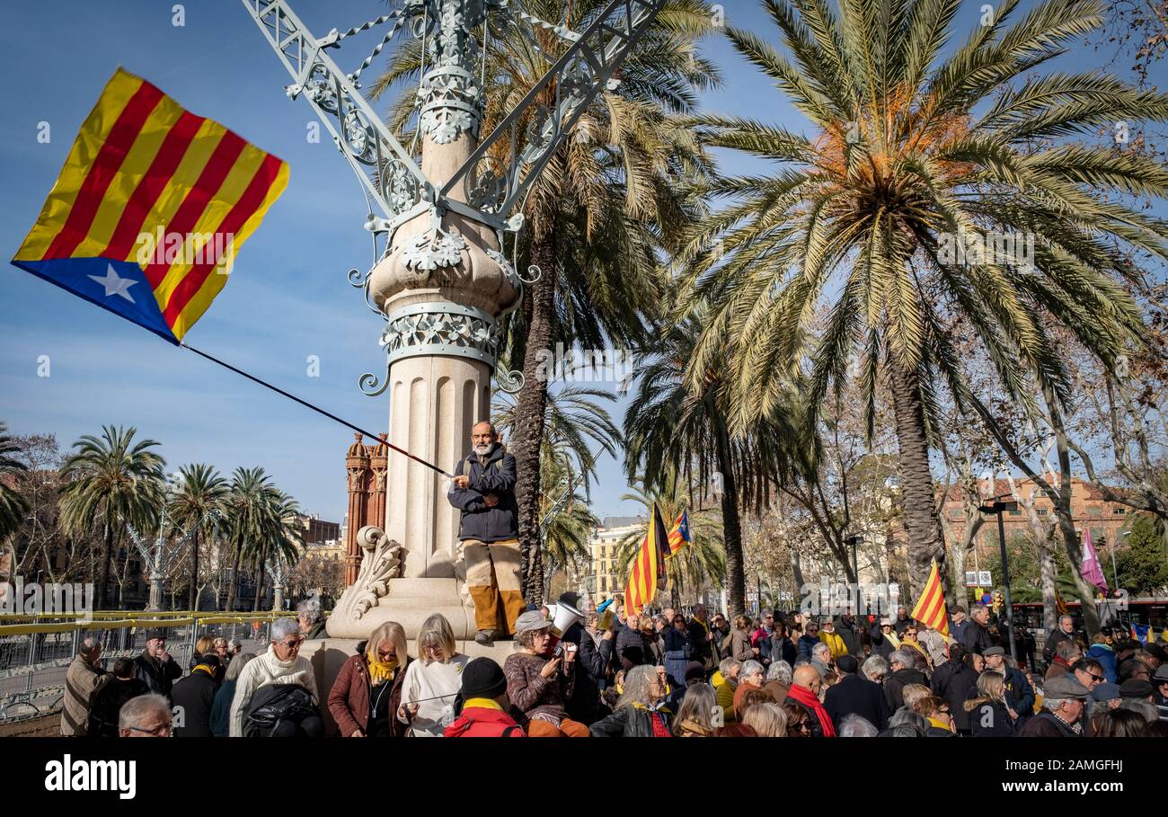 A supporter for the independence of Catalonia waves a flag for the ...