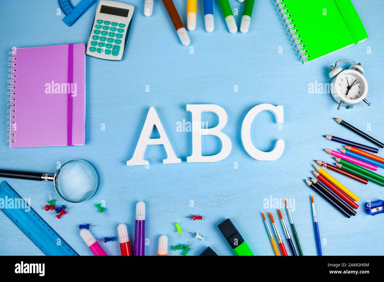 Back to school. Items for the school and letters ABC on a wooden table ...
