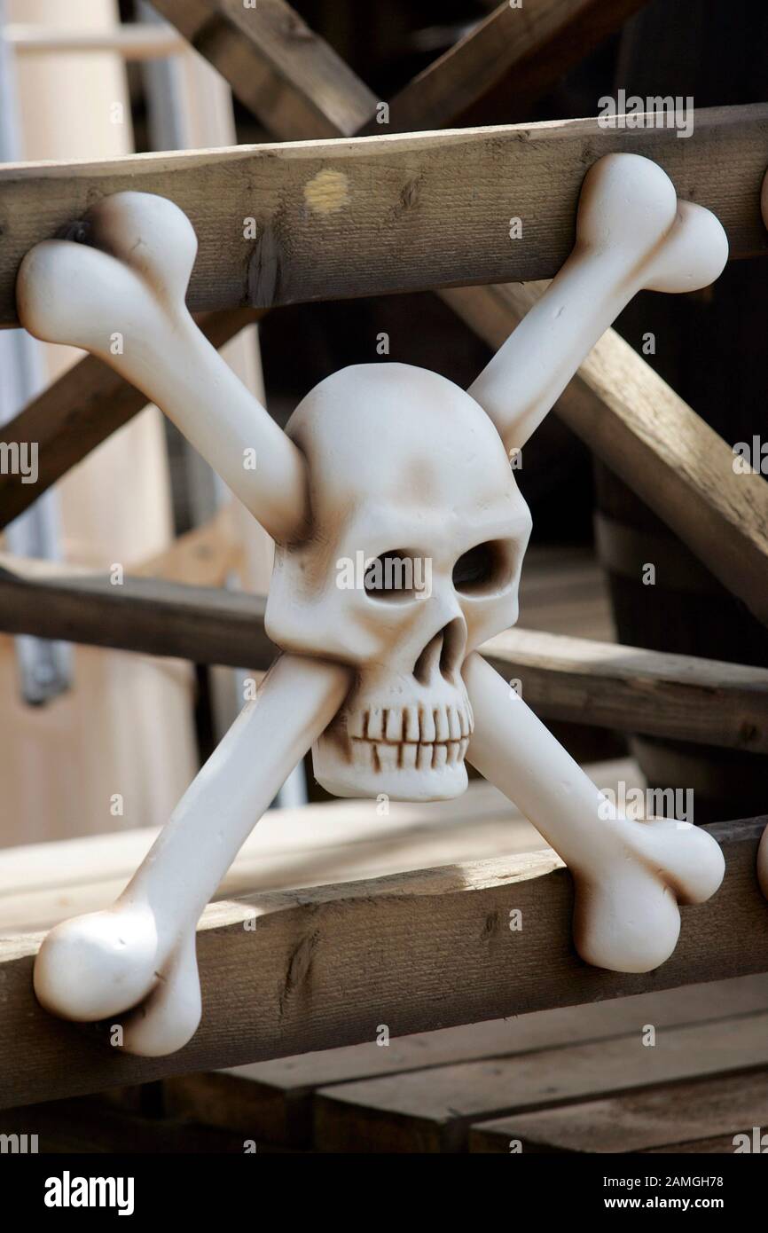 Skull and crossbone, cross bone beside a theme park pirate ship Stock ...