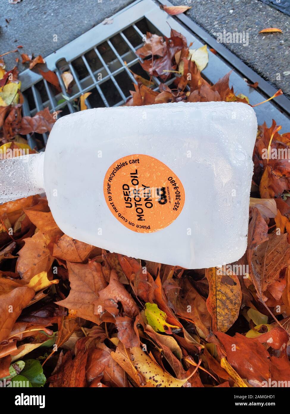 Close-up of plastic waste motor oil collection container, washed into a ...