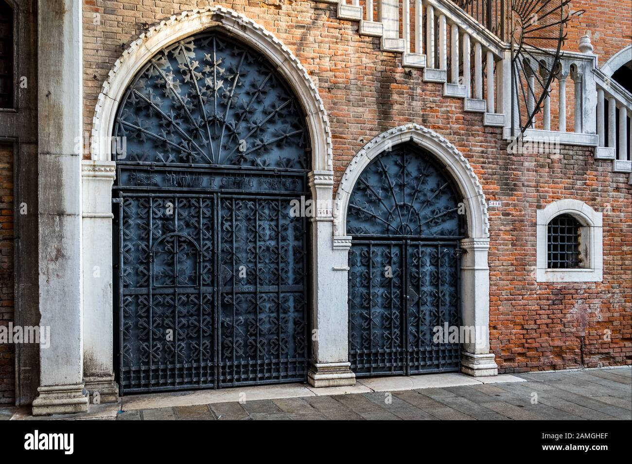 Wrought iron gates in Venice with the inscription 'Piscis primum a ...
