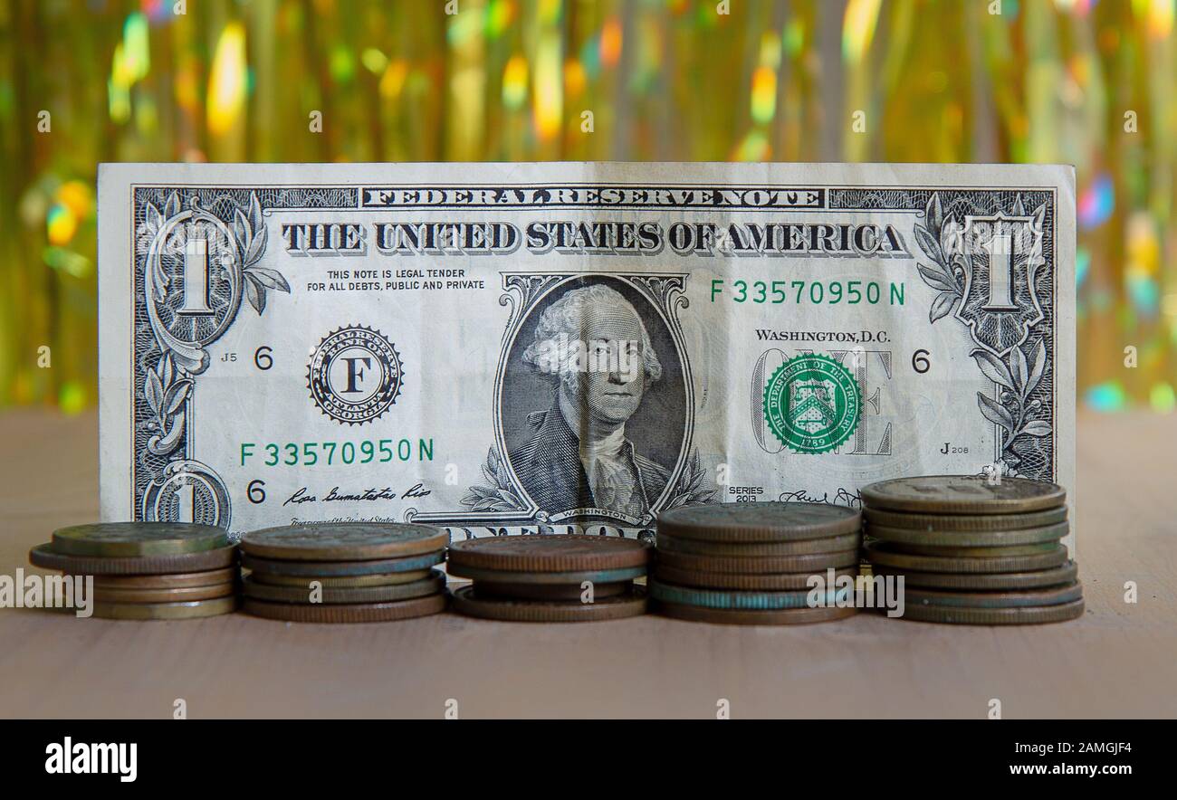 dollar and coins Stock Photo - Alamy