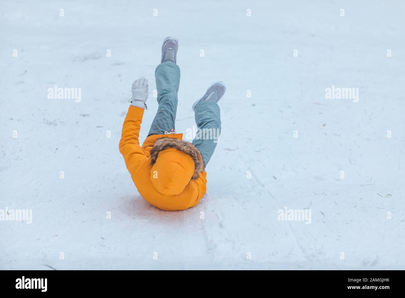 Woman sliding snow sled hi-res stock photography and images - Alamy