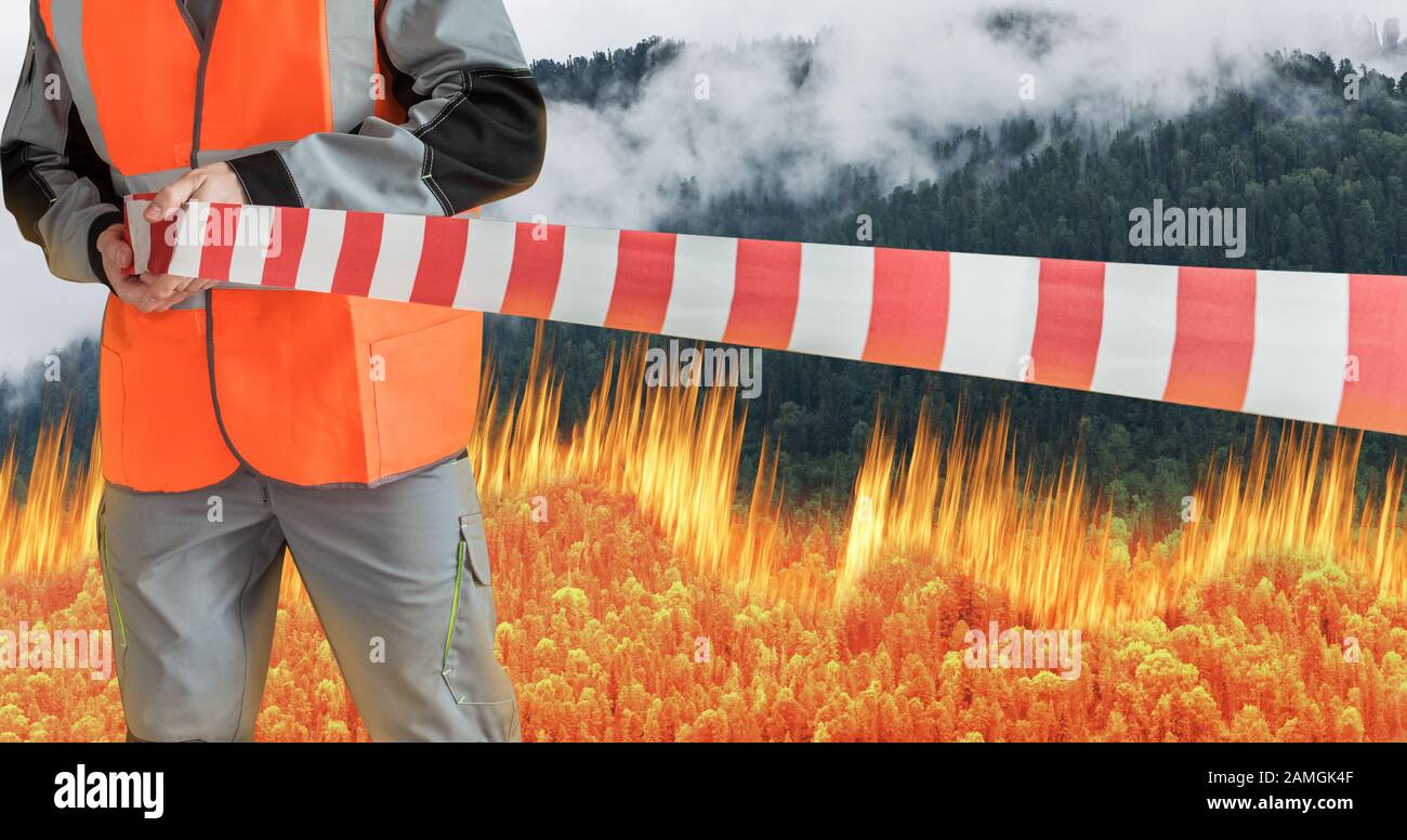 Firefighter blocks access Stock Photo - Alamy
