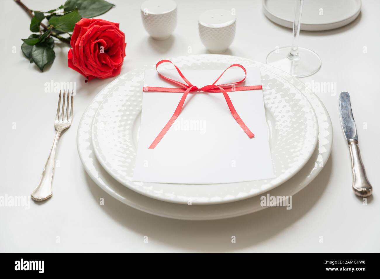 Valentine's day or birthday dinner. Elegance table setting with red ...