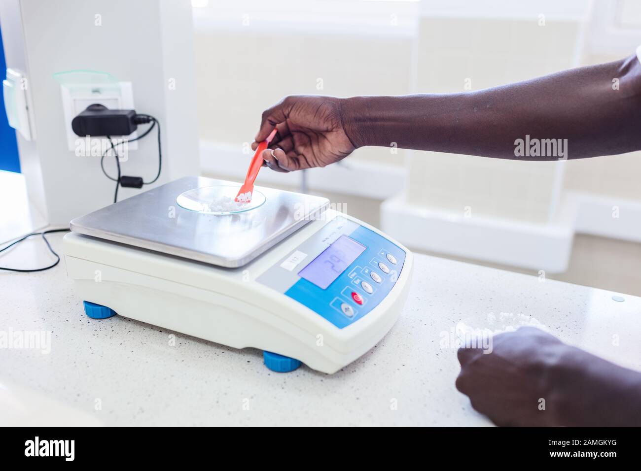 African scientist testing salt in the laboratory Stock Photo - Alamy