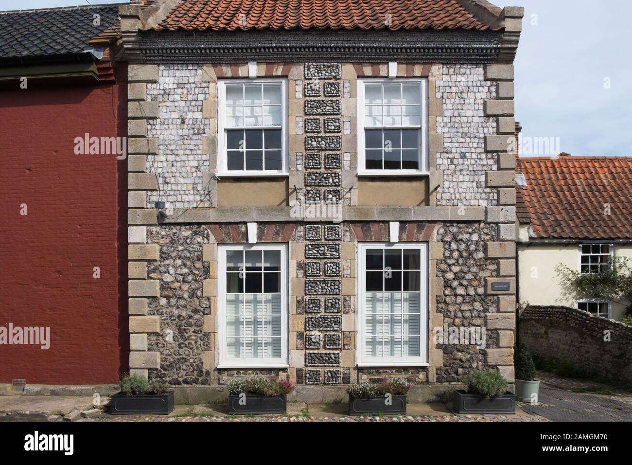 Traditional flint houses in the village of Cley Next The Sea, North ...