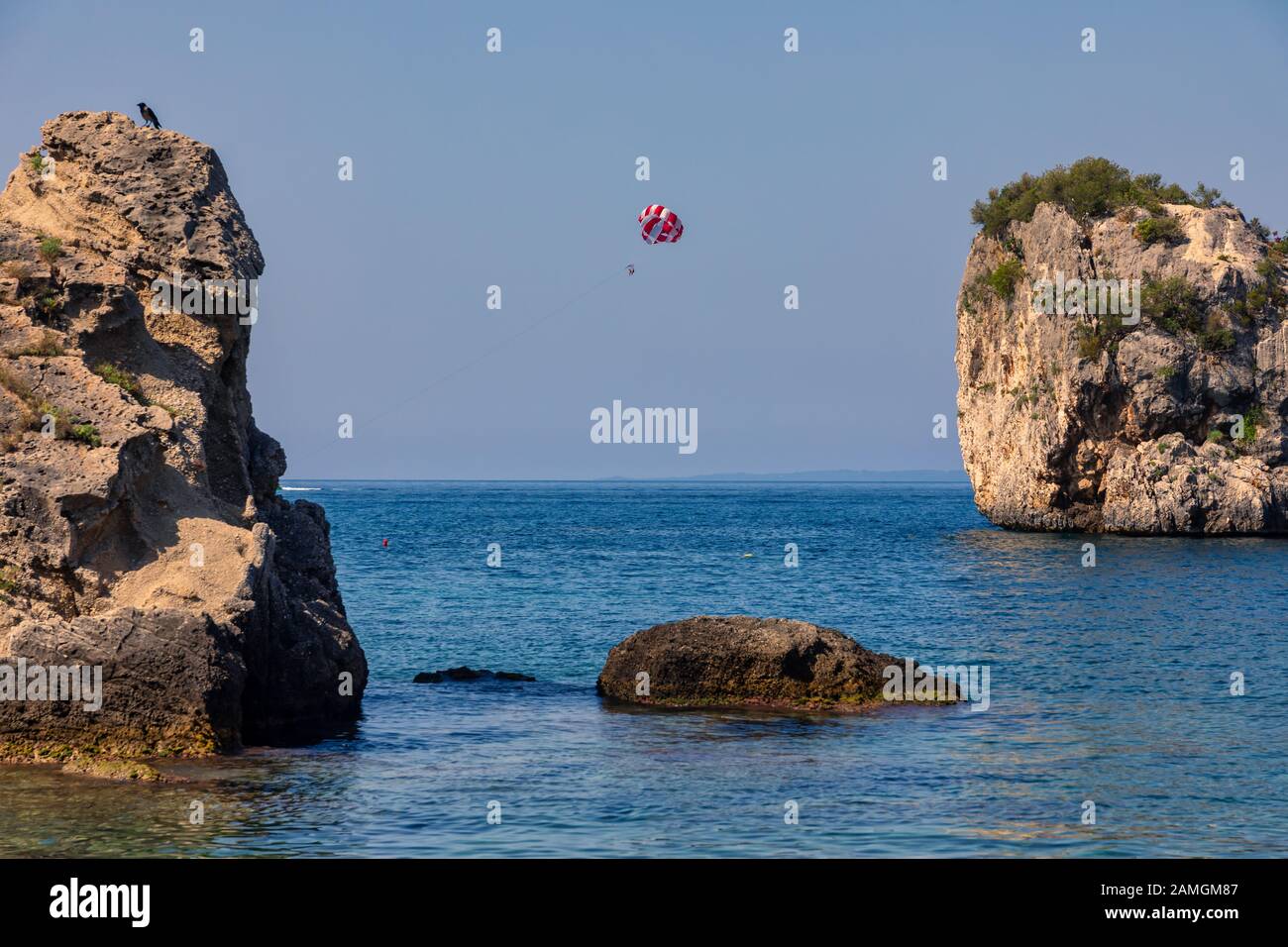 Parachute behind a boat on a summer holiday beach in Parga Epirus ...