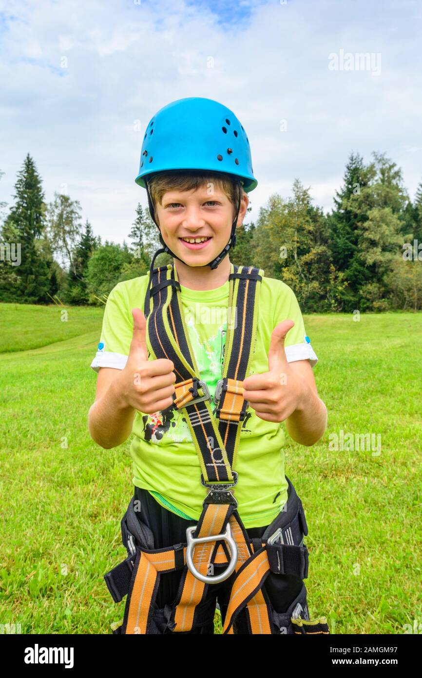 Funny afternoon in high ropes course Stock Photo - Alamy