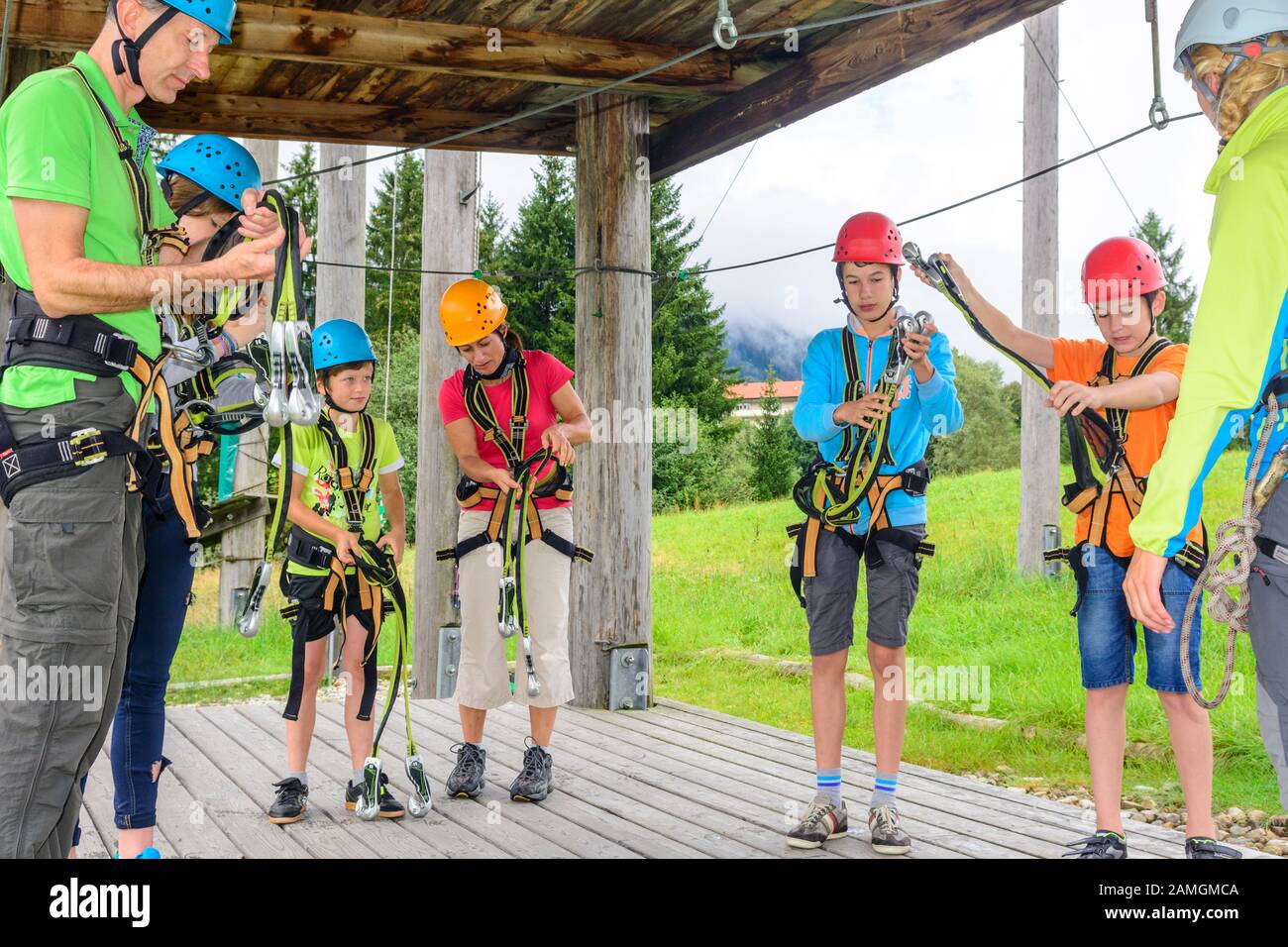 Funny afternoon in high ropes course Stock Photo - Alamy