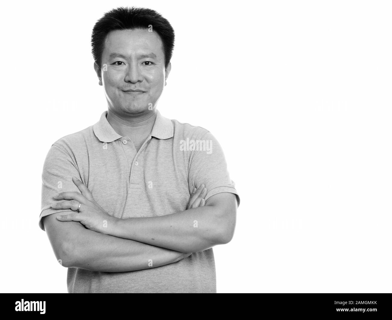 Studio shot of Japanese man with arms crossed Stock Photo - Alamy
